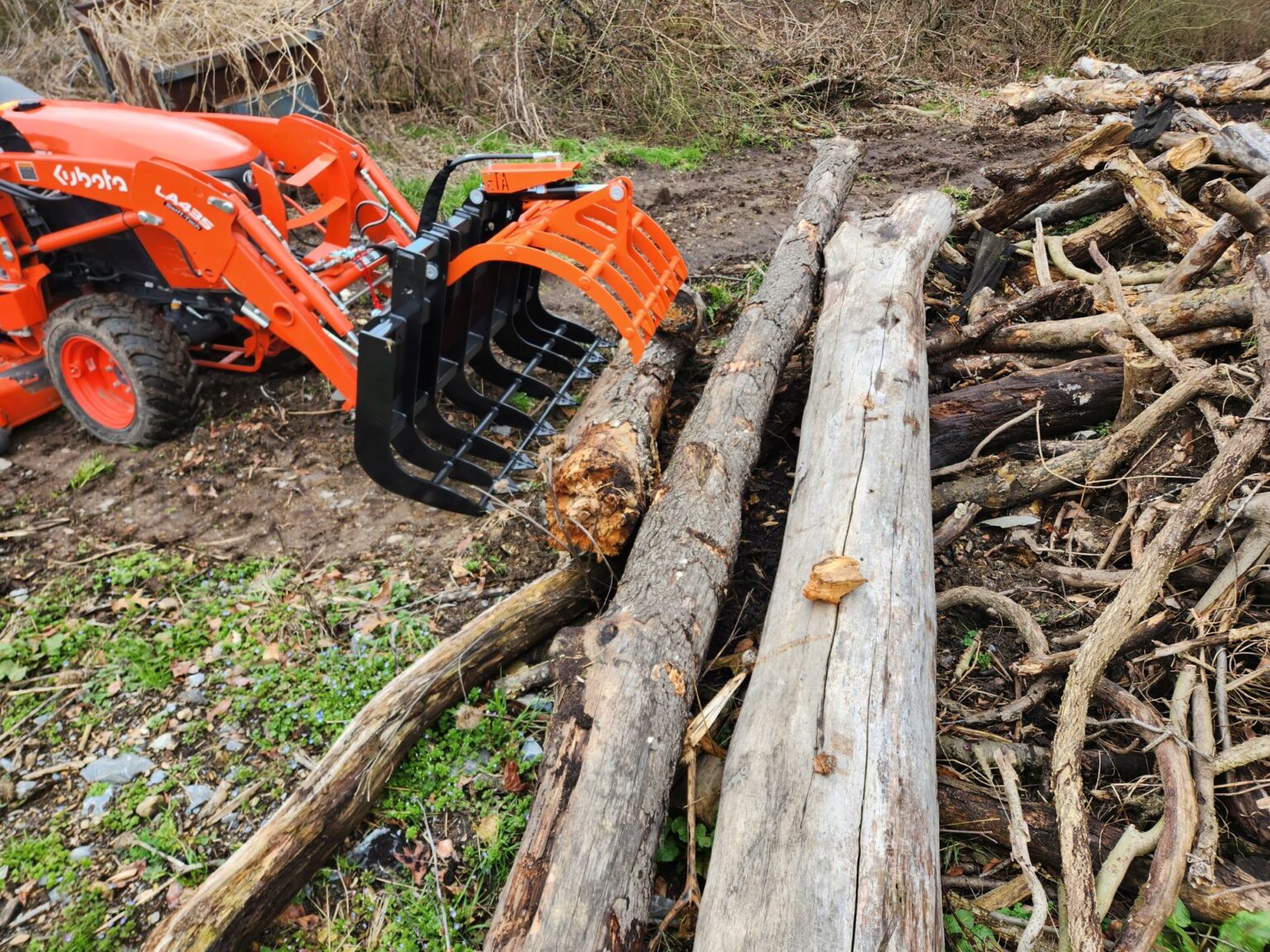 Hybrid Grapple for Compact Tractors - Earth & Turf Attachments, LLC