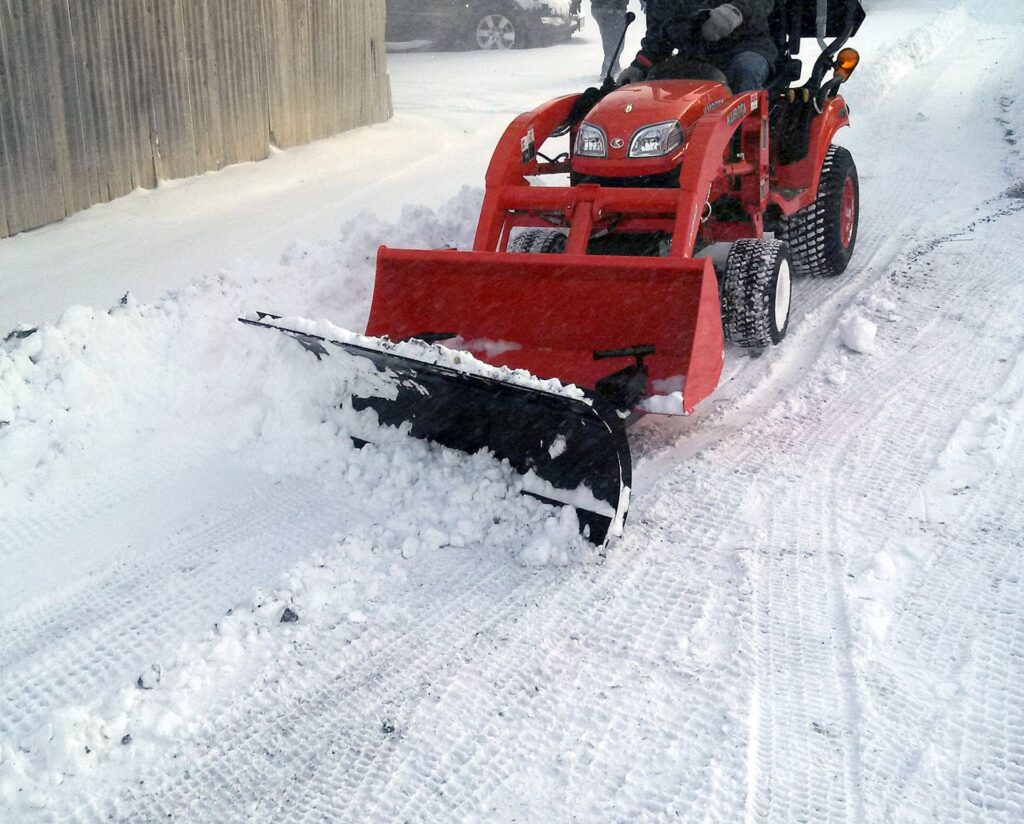 Clamp-On Snow Plows for Compact Tractors | Earth & Turf Attachments